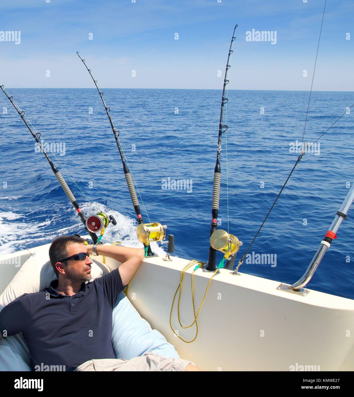 Sailor man fishing resting in boat summer vacation blue sea Stock Photo ...