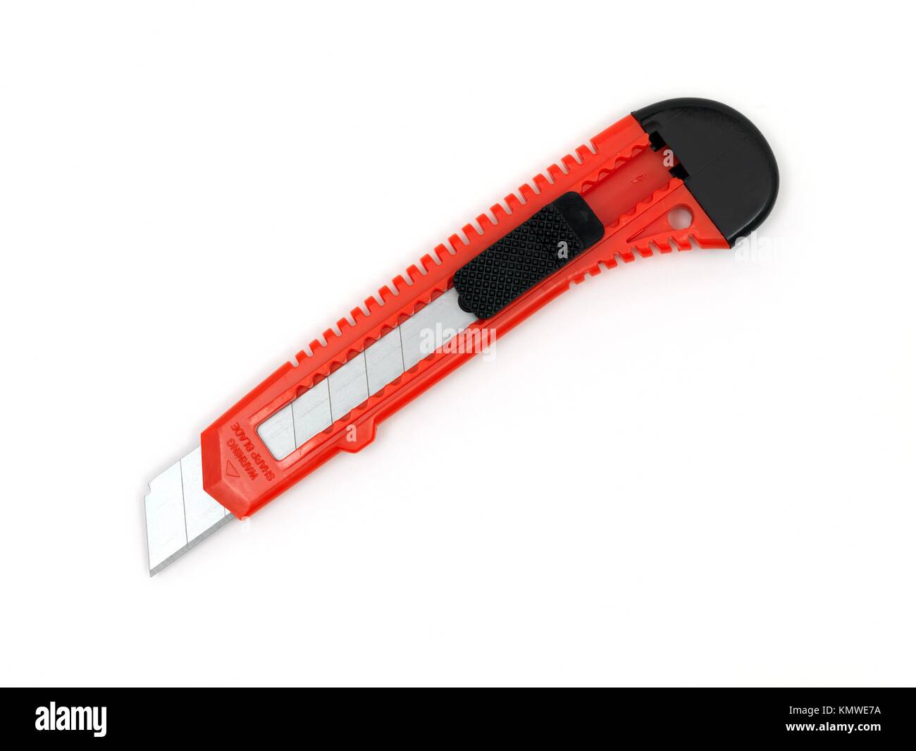 A box cutter isolated against a white background Stock Photo - Alamy