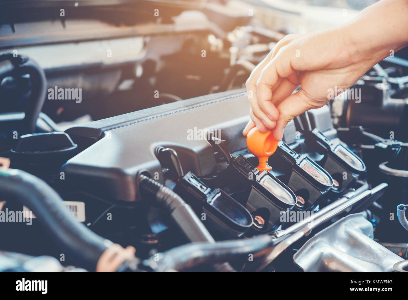Car Engine oil mechanic working in auto repair service Stock Photo - Alamy