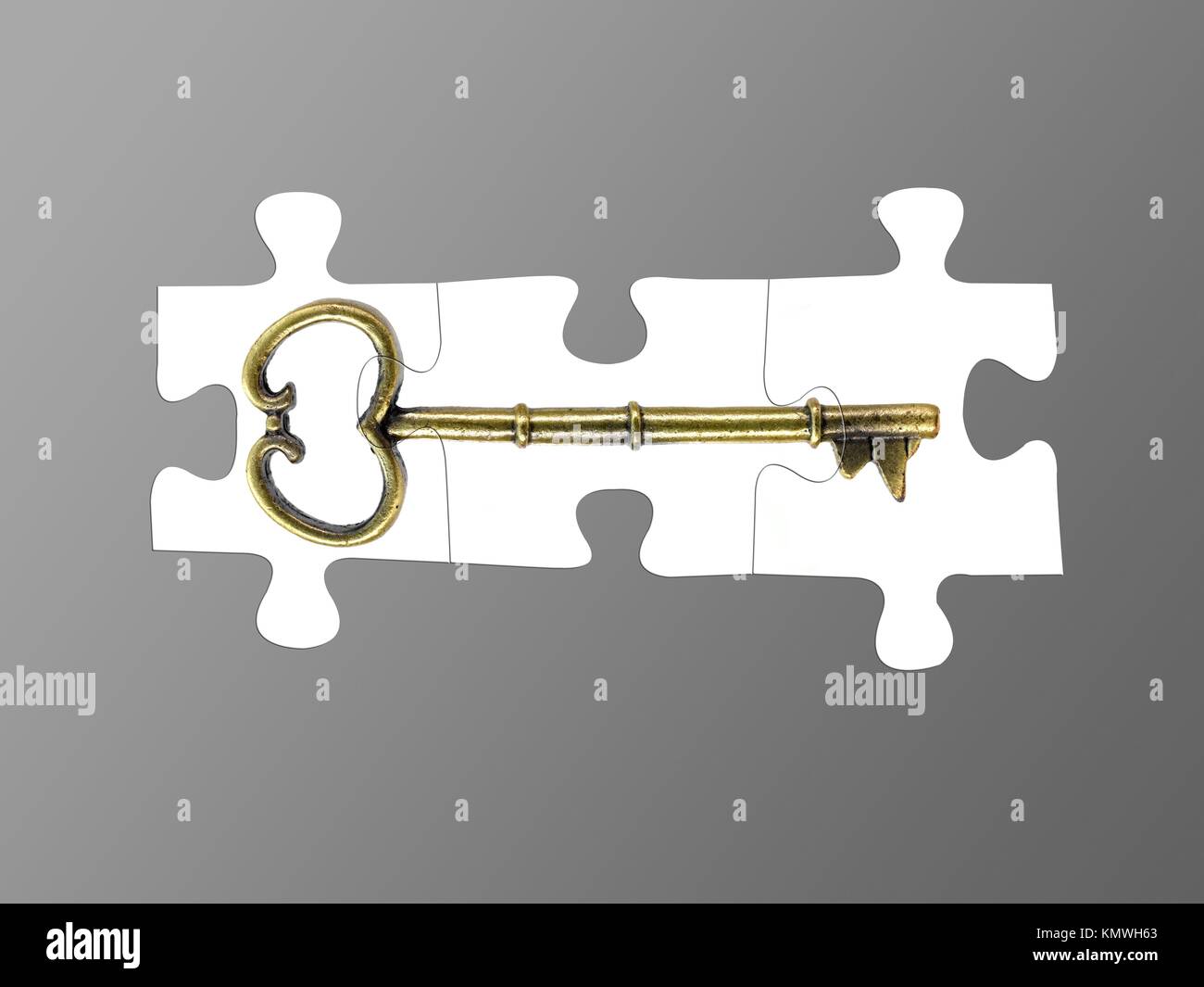 Jigsaw puzzle pieces of a key isolated against a grey background Stock ...