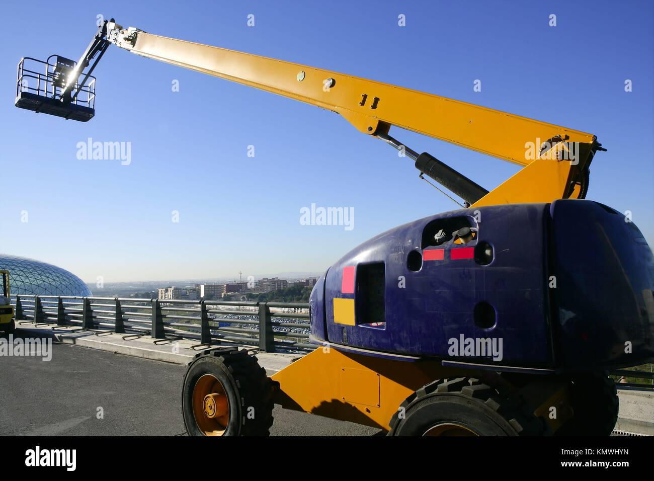 Car little hydraulic crane in blue and yellow colors Stock Photo - Alamy