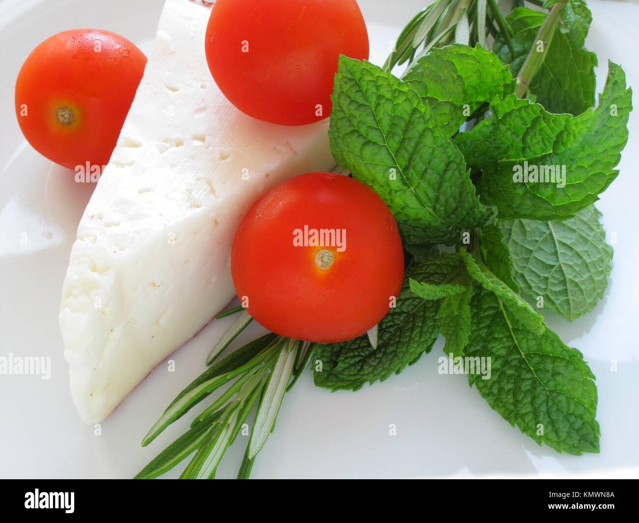 Tronchón cheese, herbs and tomatoes Stock Photo - Alamy