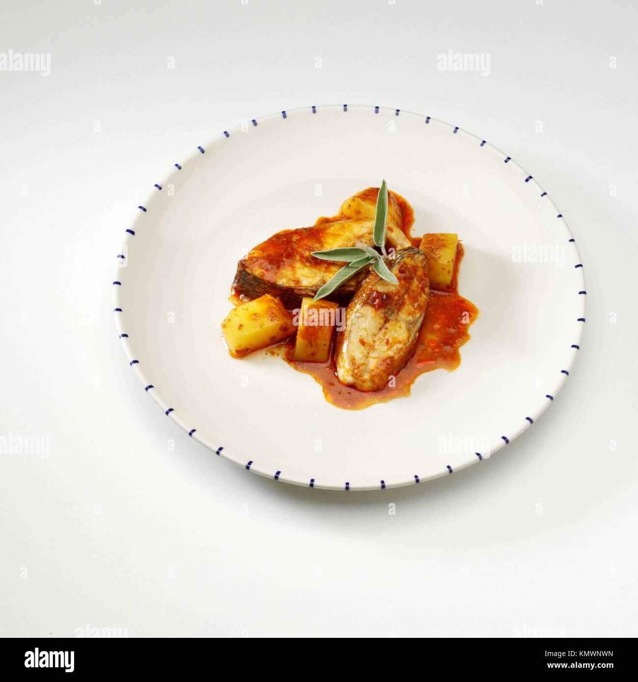 Fish with romesco sauce Stock Photo - Alamy