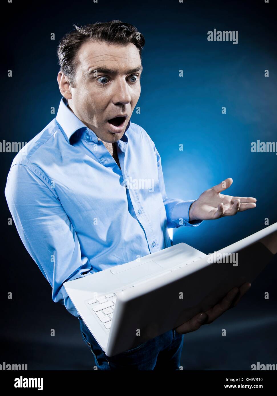 caucasian man stun computer breakdown portrait isolated studio on black ...