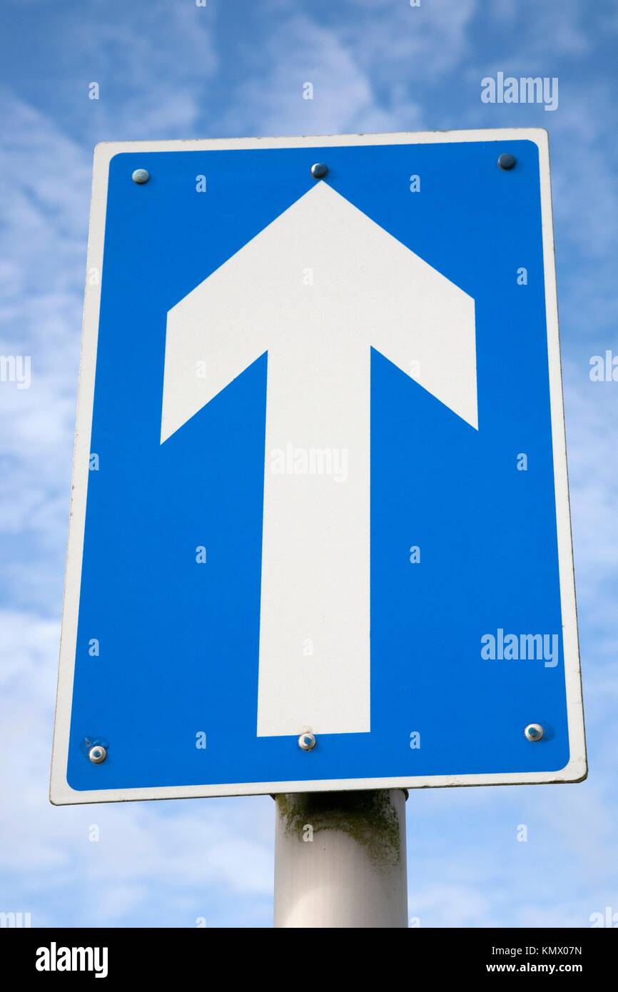 Blue traffic sign white arrow hi-res stock photography and images - Alamy
