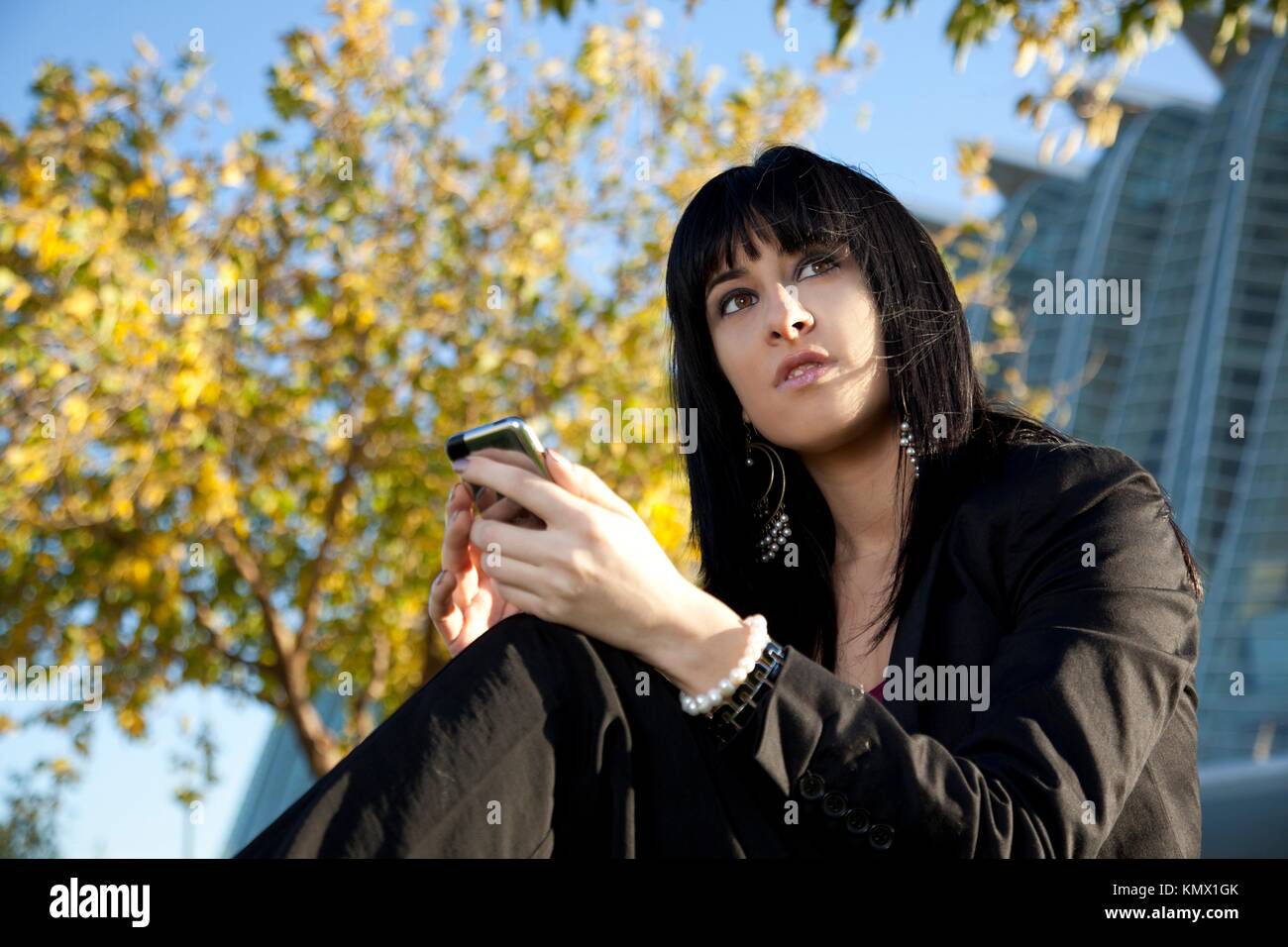 Girl using a mobile phone Stock Photo - Alamy