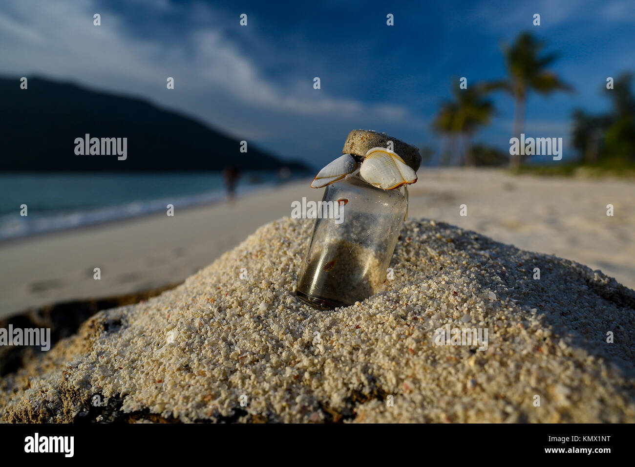 small bottle on sand Stock Photo - Alamy
