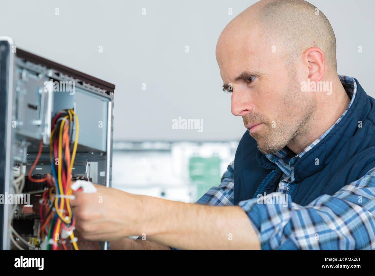 computer engineer working on broken console Stock Photo - Alamy
