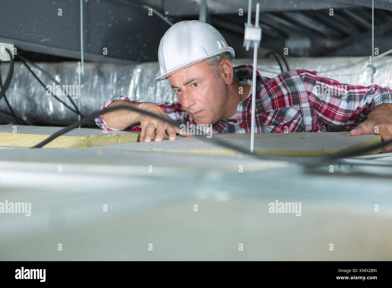 man repairing electrical wiring on the ceiling Stock Photo - Alamy