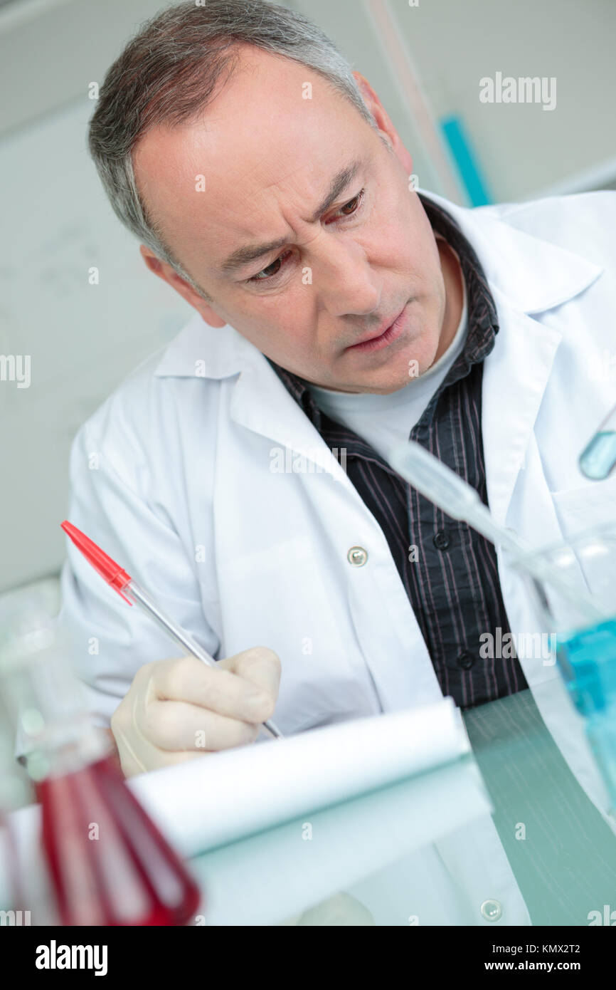 Scientist making notes desk hi-res stock photography and images - Alamy