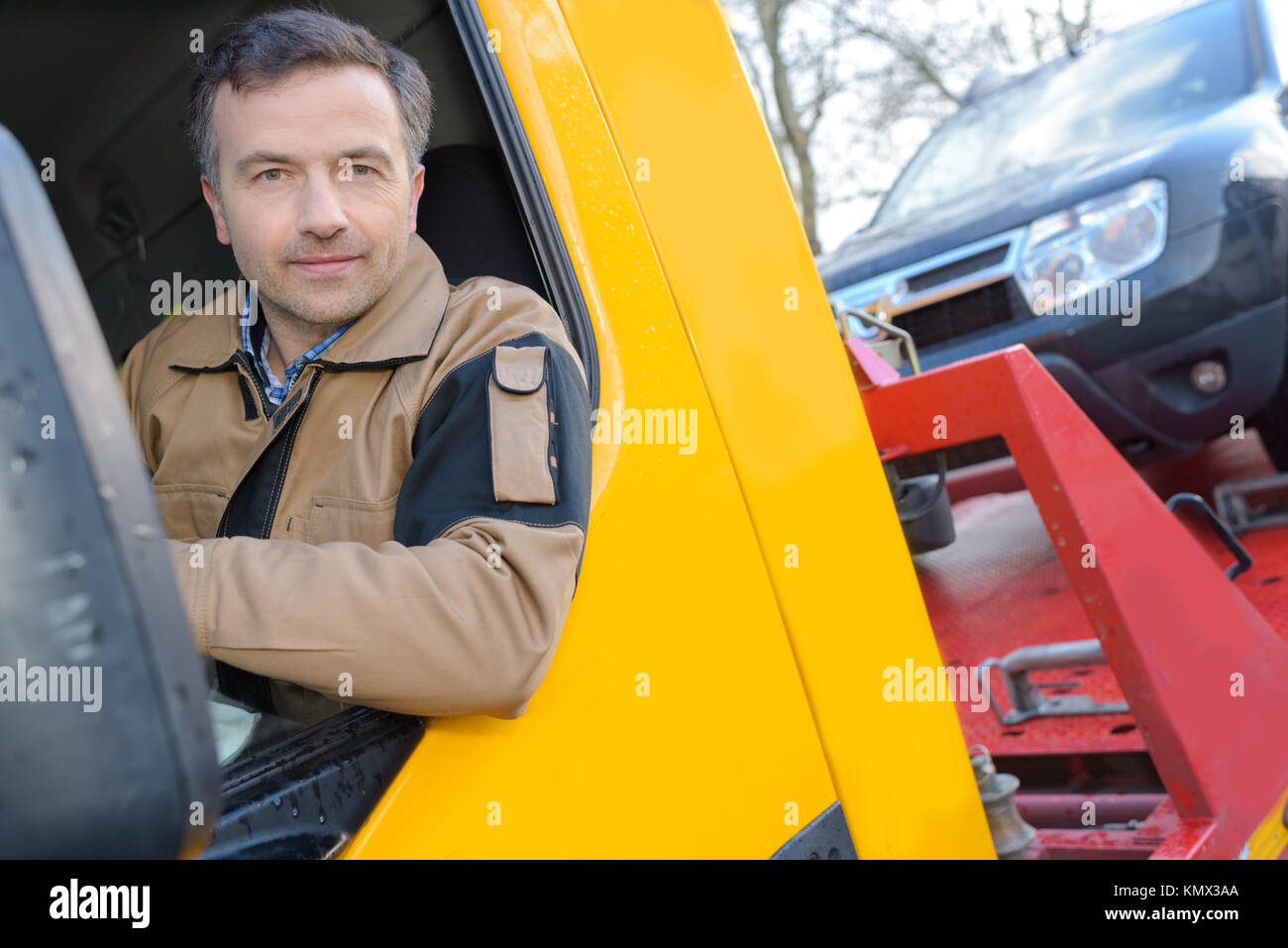 handsome driver near big modern truck Stock Photo - Alamy