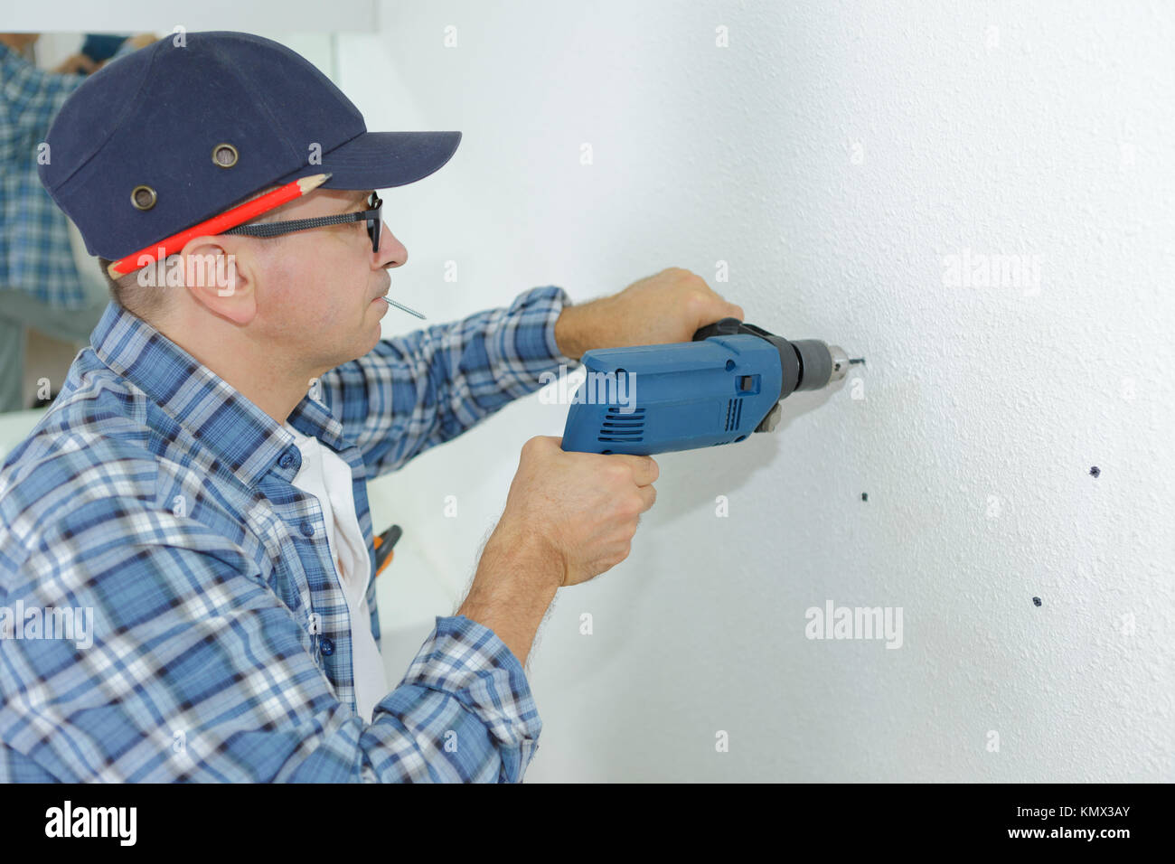 Two man drilling hi-res stock photography and images - Alamy