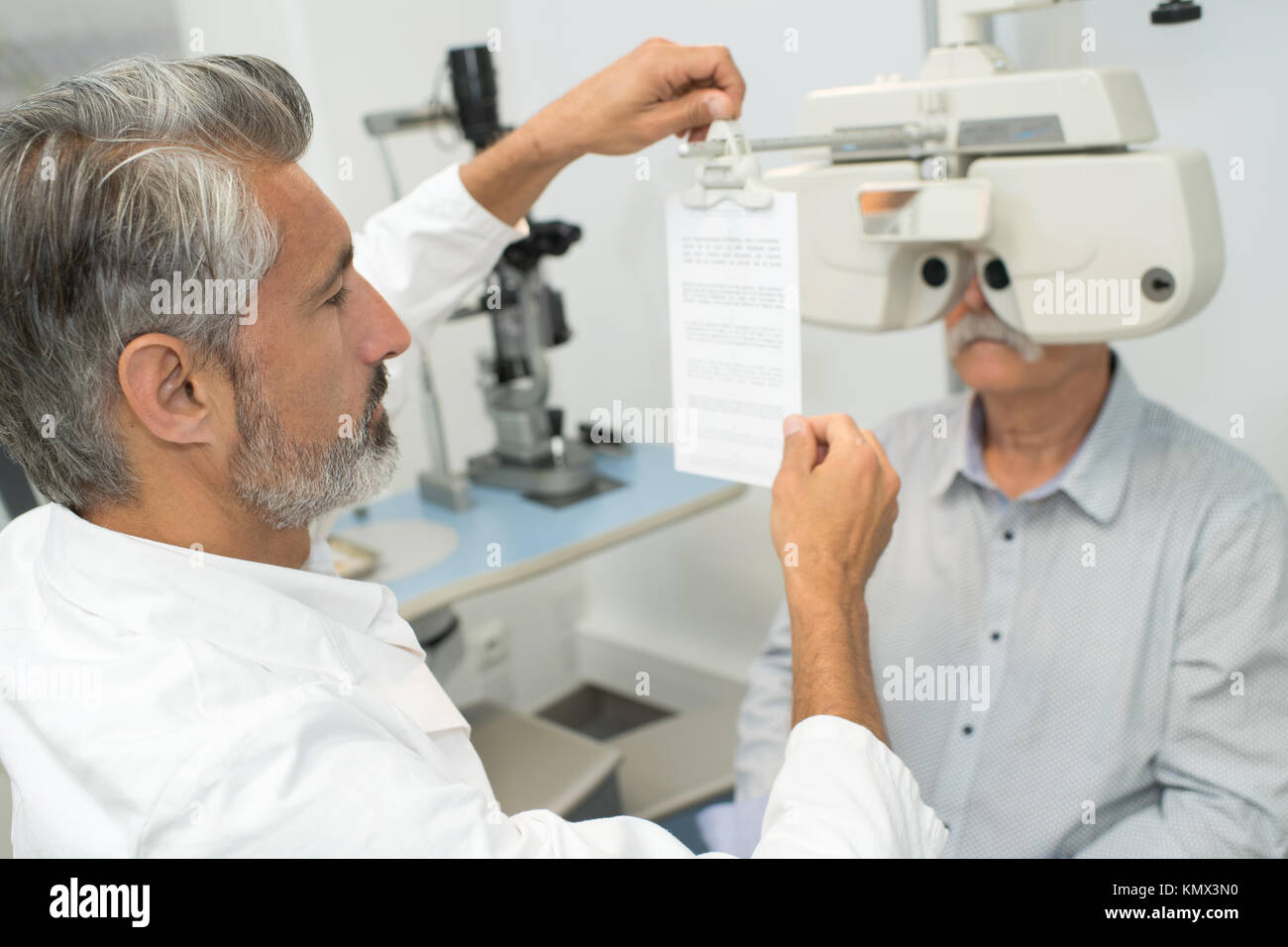 adult male doctor near with ophthalmic equipment Stock Photo - Alamy