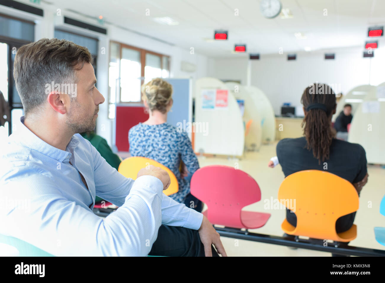 people waiting for their turn Stock Photo - Alamy