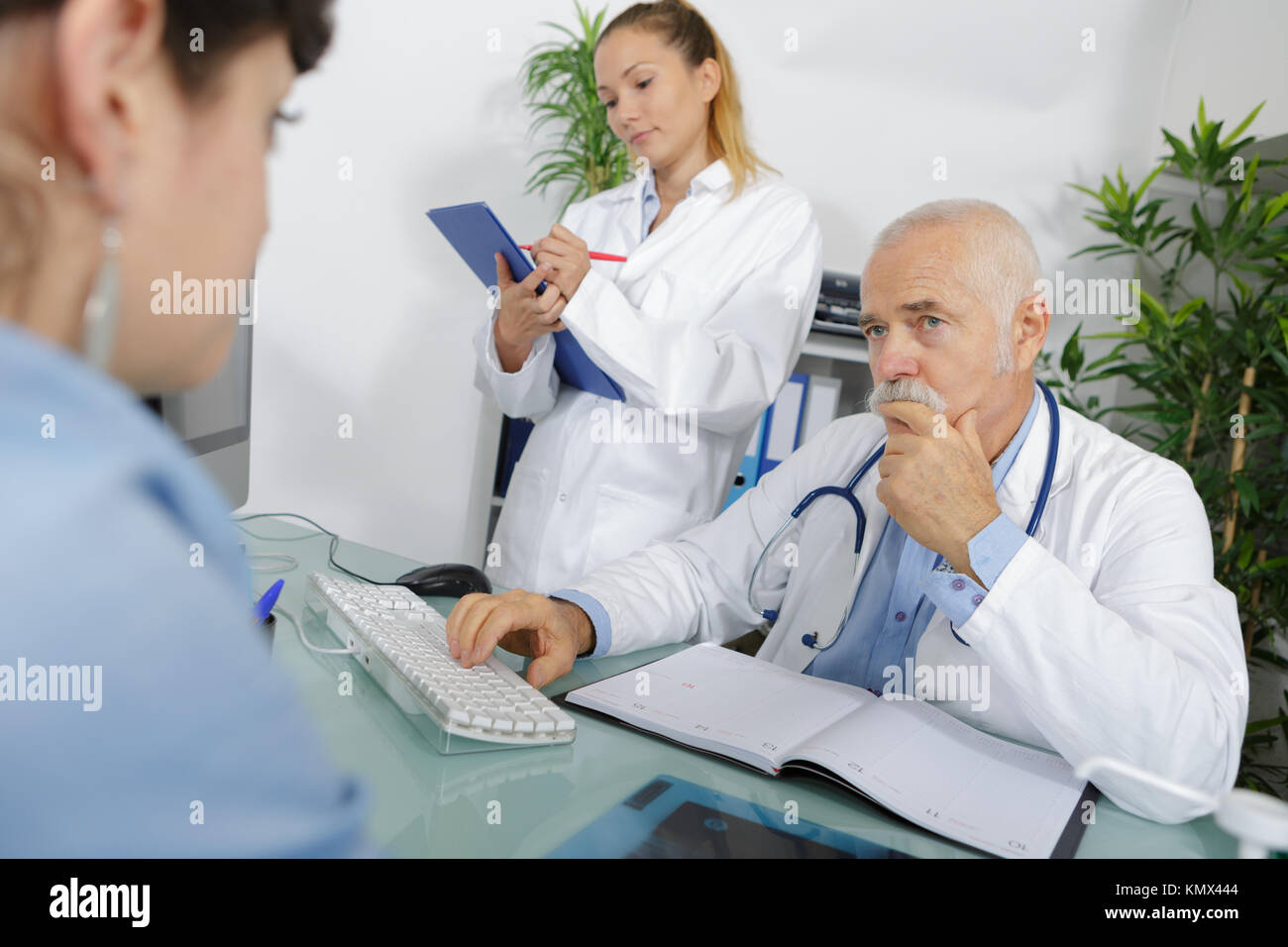 patient consulting a senior doctor in the hospital Stock Photo - Alamy