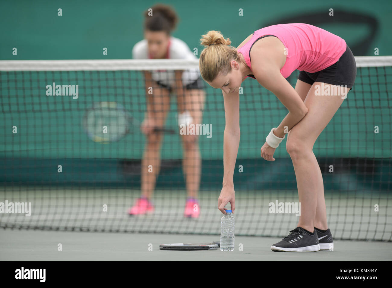 portrait of exhausted female tennis players Stock Photo - Alamy