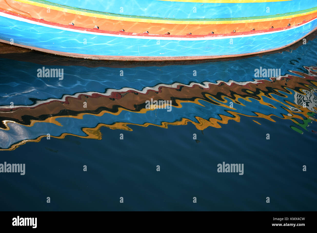 Reflections of a boat in Harbour Stock Photo - Alamy