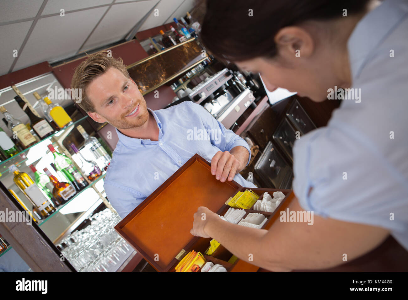 male customer buying organic tea Stock Photo - Alamy
