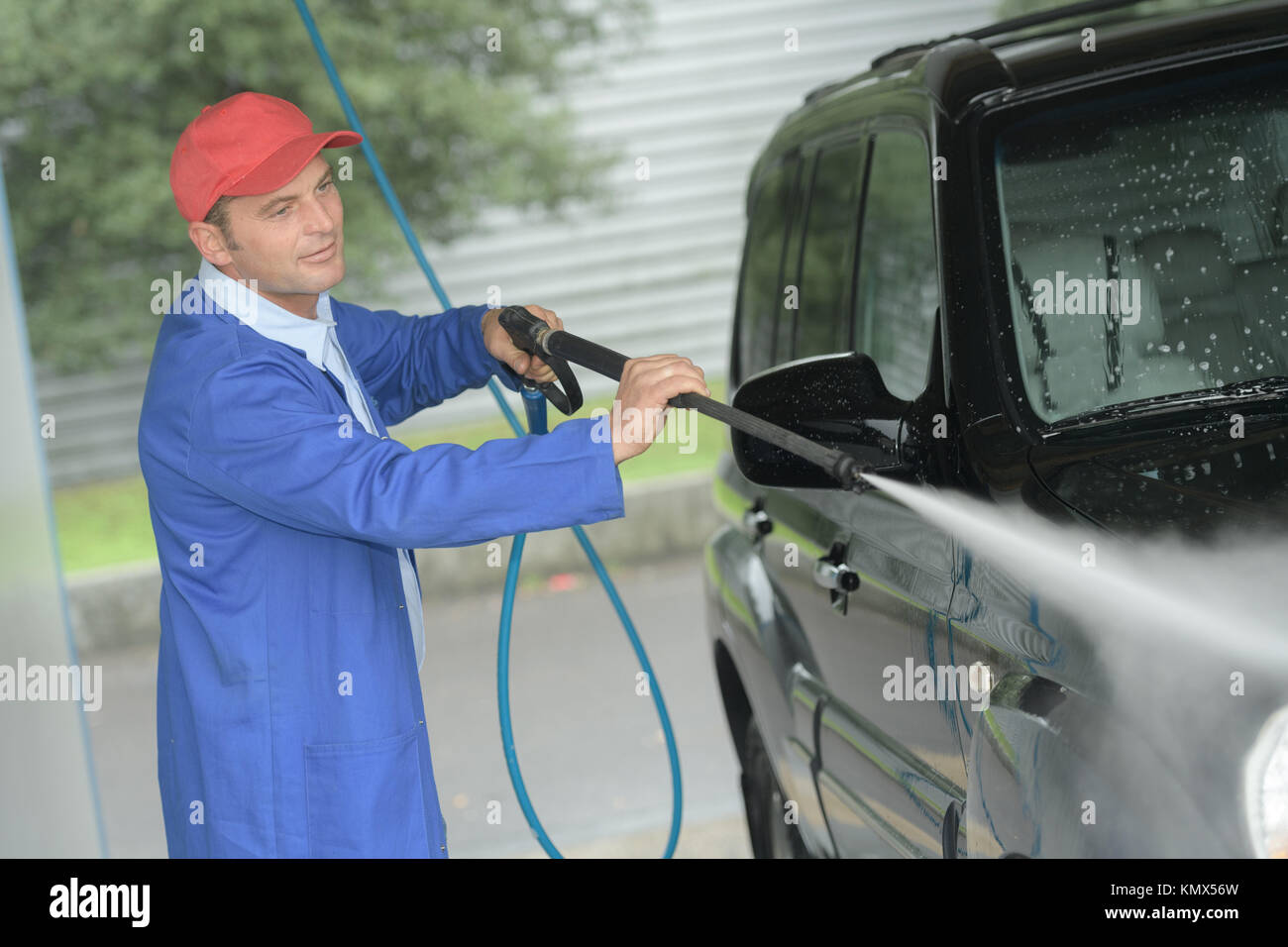 blue car washing on open air Stock Photo - Alamy