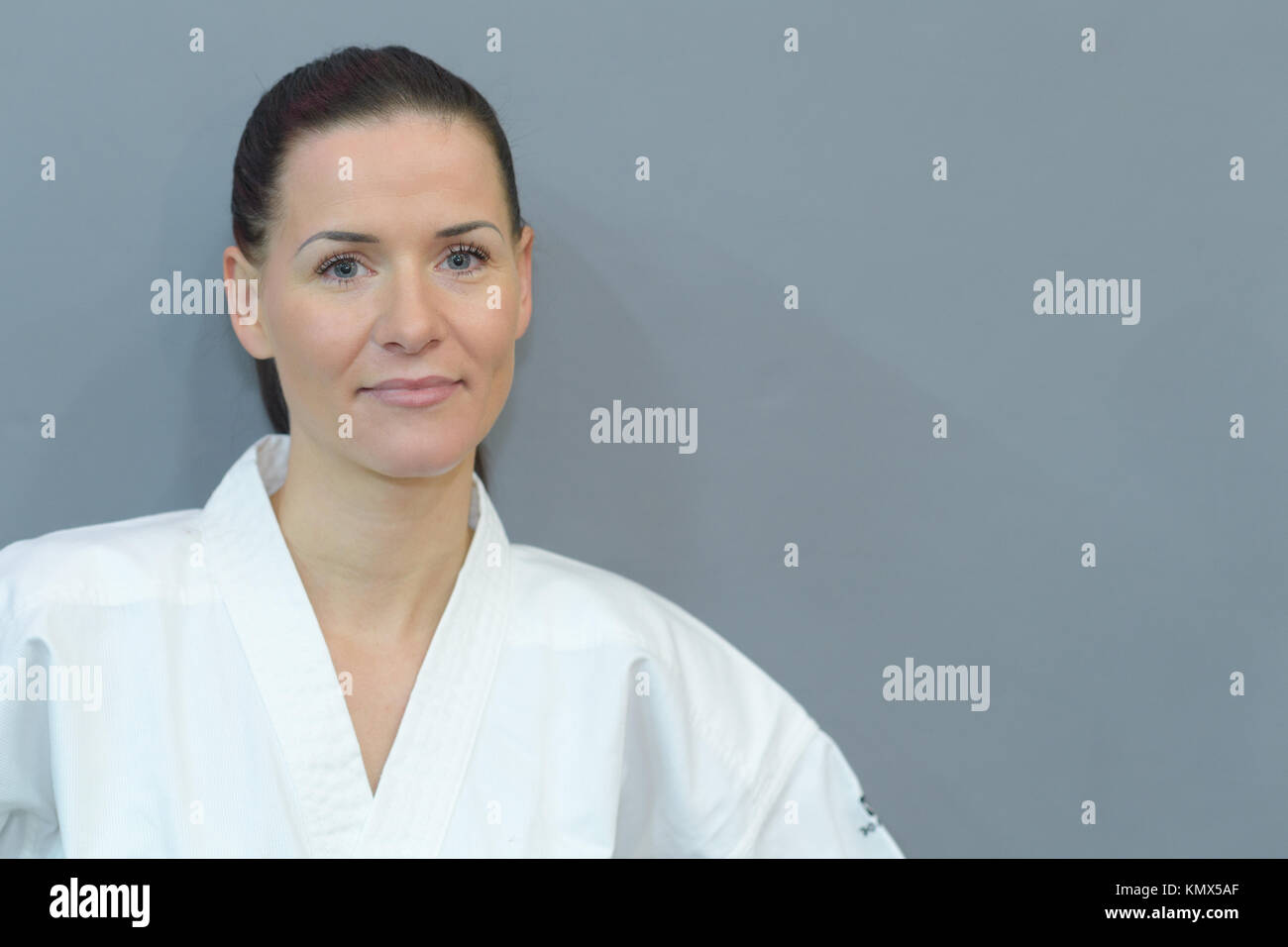 portrait of female fighter on grey background Stock Photo - Alamy