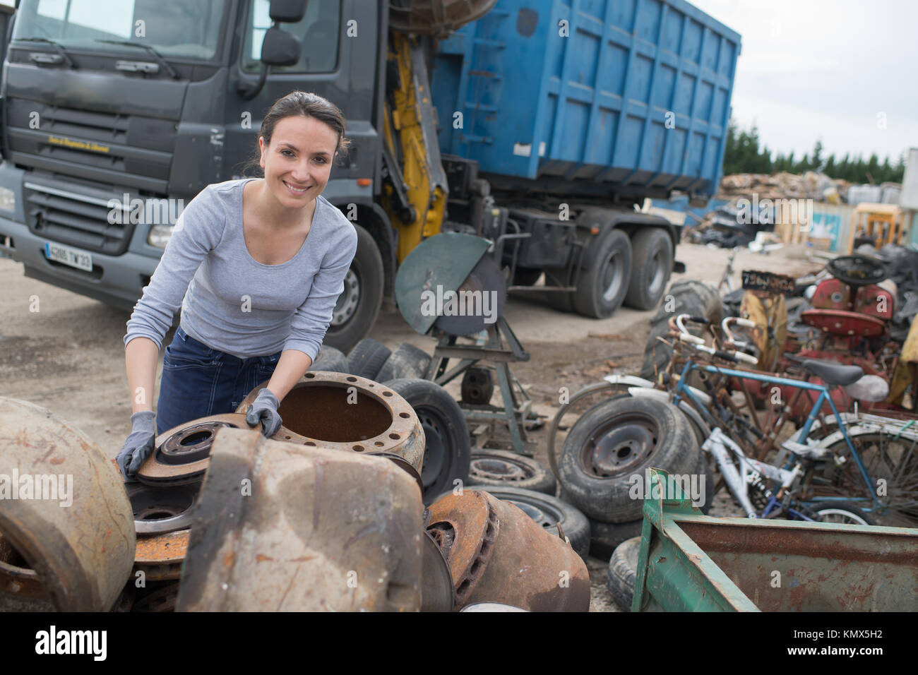 portrait of female worker in scrap yard Stock Photo - Alamy