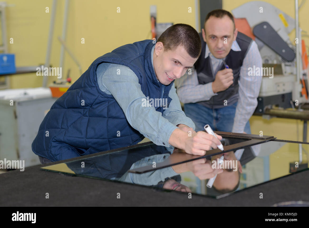 apprentice glazier with mentor monitoring Stock Photo - Alamy