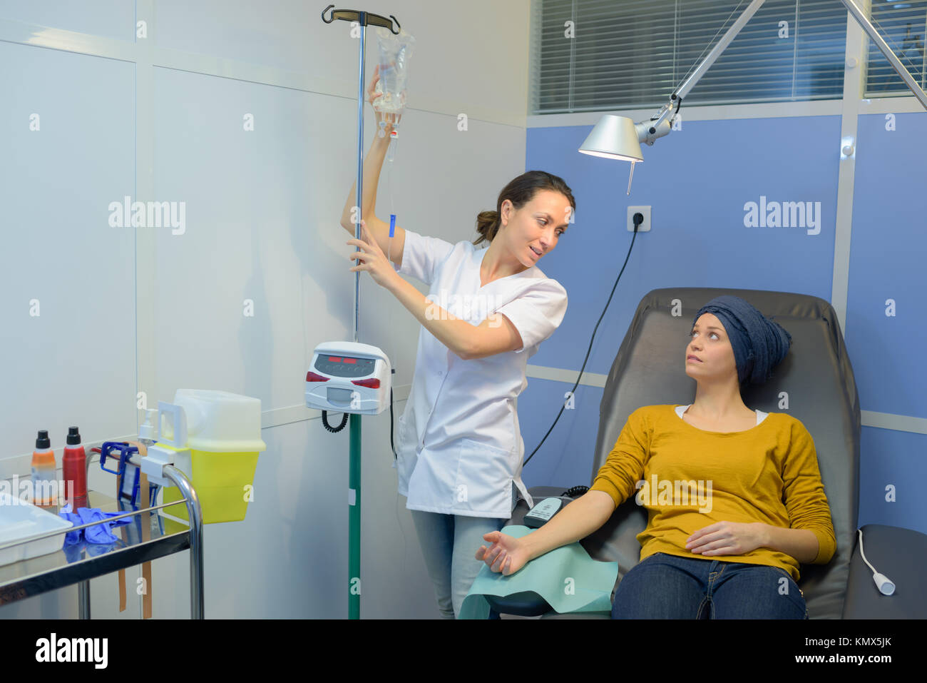 Young lady being connected up for chemotherapy Stock Photo - Alamy