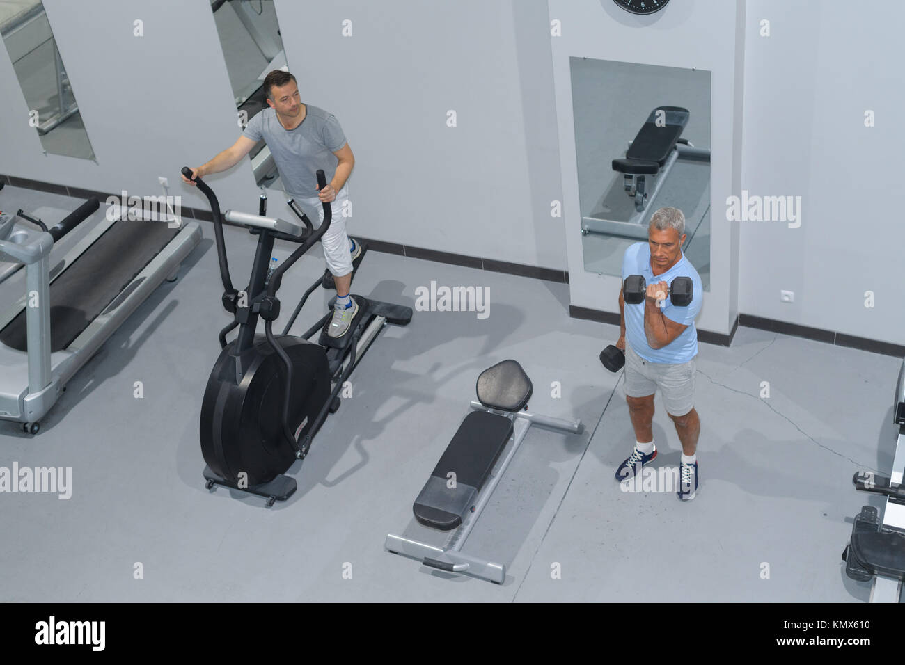 two men doing workout in a fitness club Stock Photo - Alamy