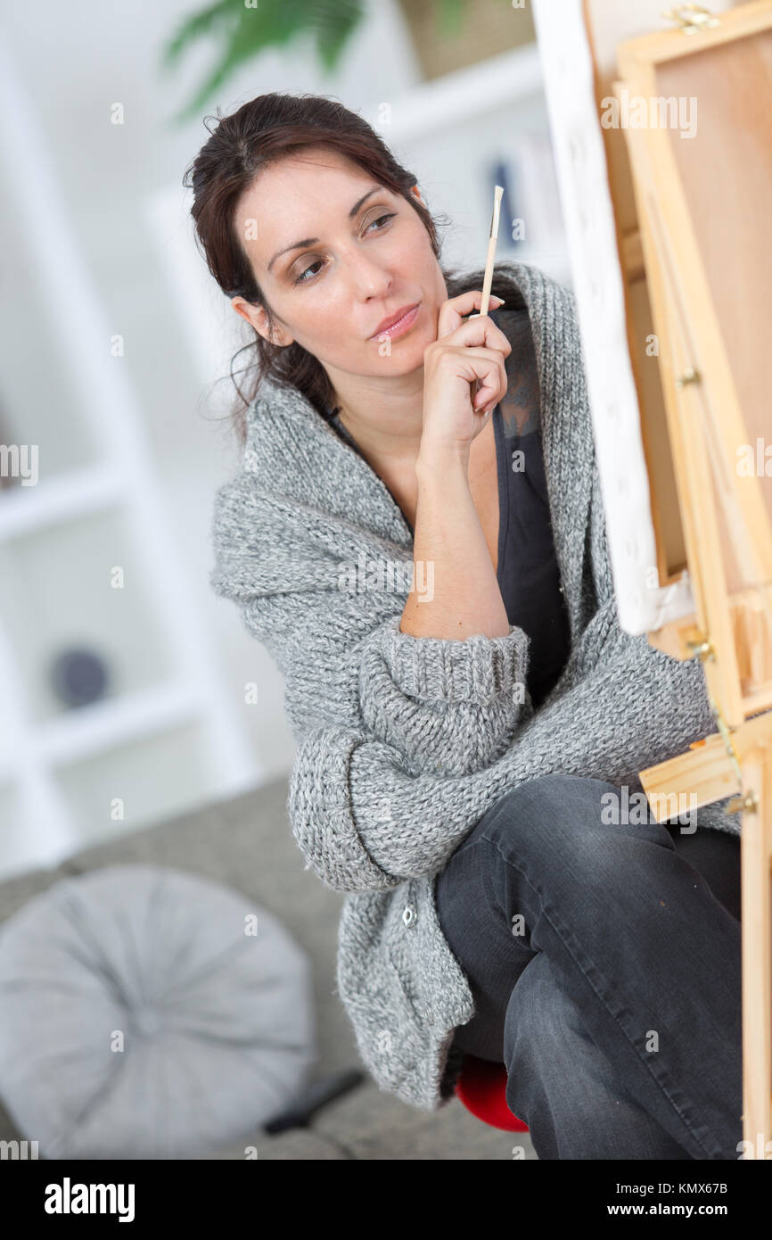 thoughtful woman painter thinking in artist workshop Stock Photo - Alamy