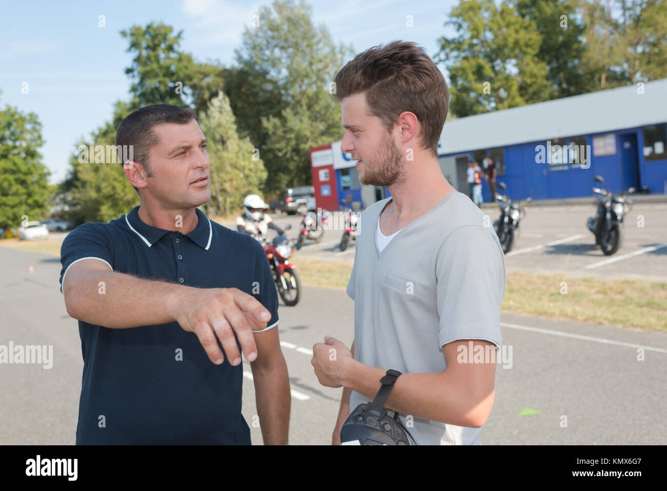 young man taking motorcycle driving lesson Stock Photo - Alamy