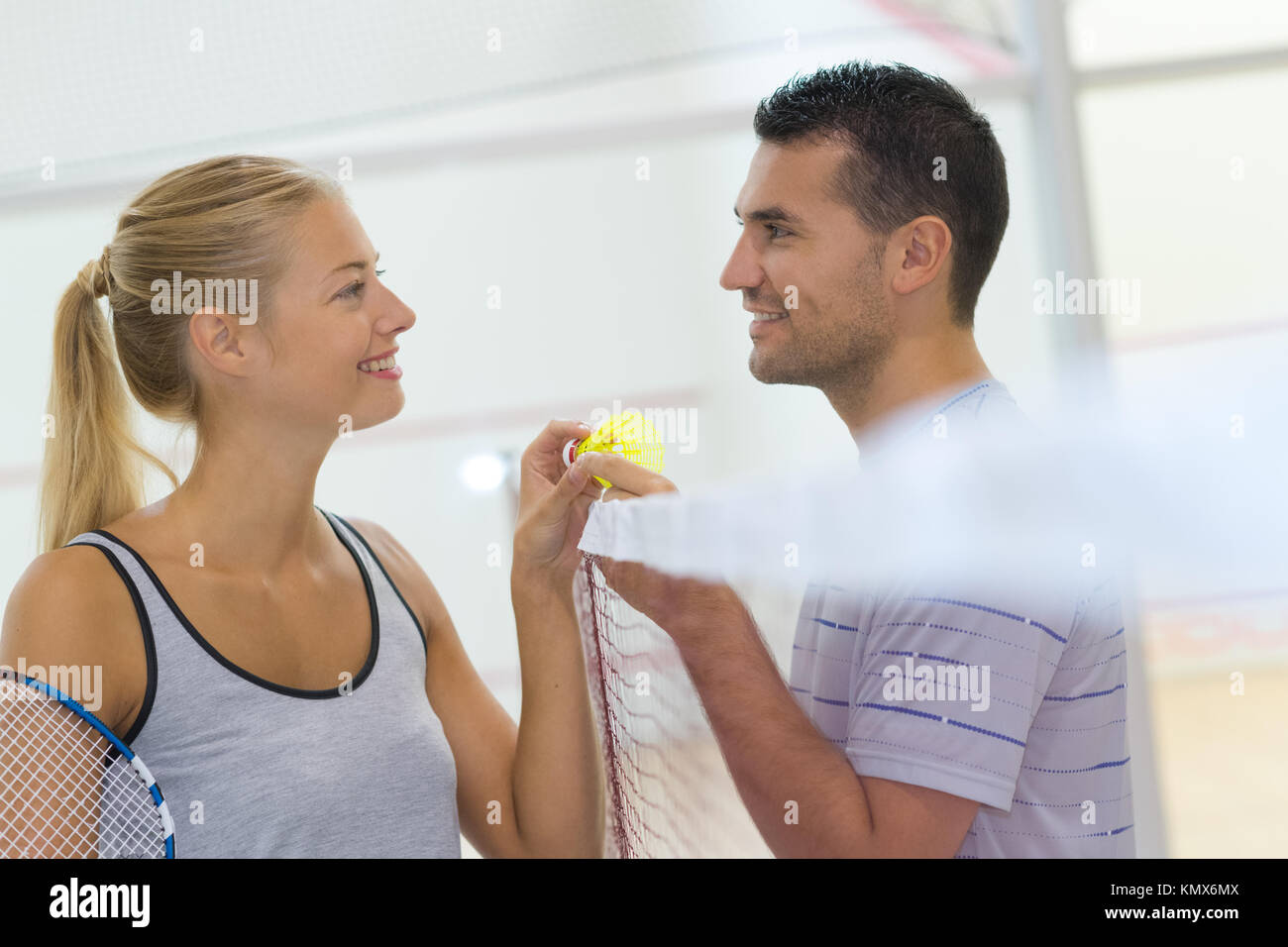 Happy people playing badminton together hi-res stock photography and ...