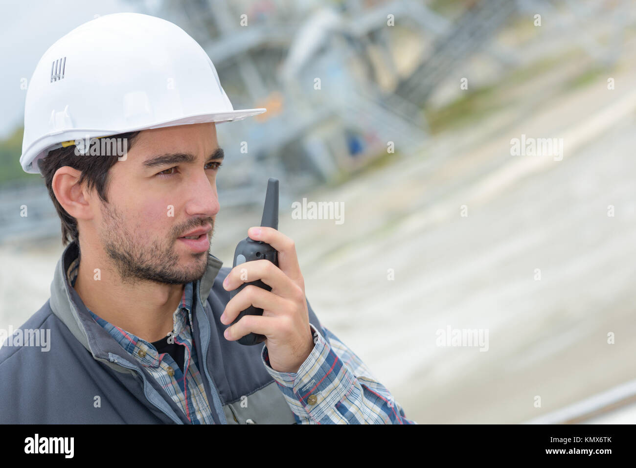 engineer talking through a walkie-talkie Stock Photo - Alamy