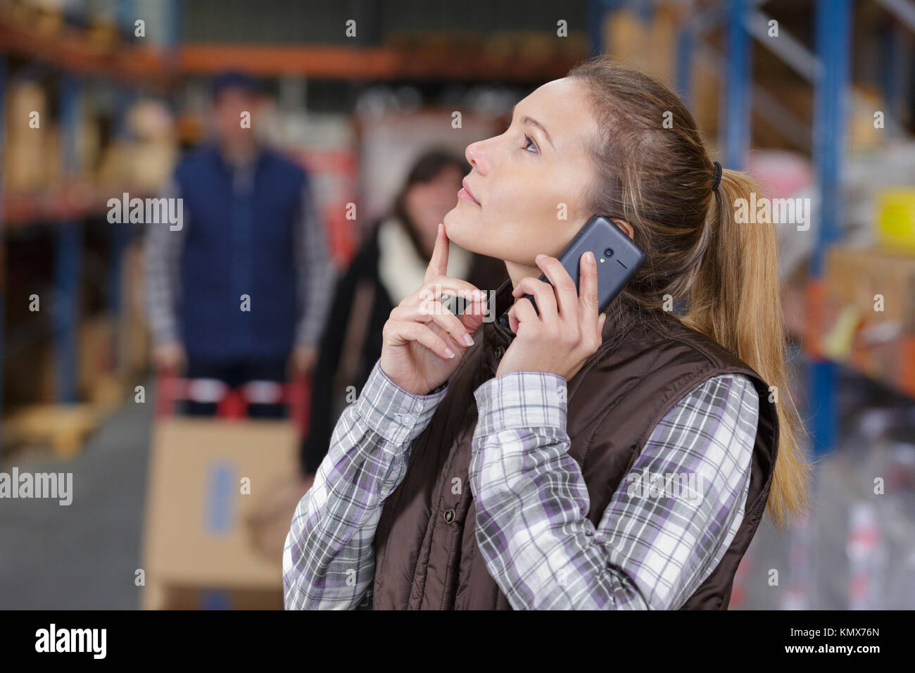 warehouse worker making a call in distribution warehouse Stock Photo ...