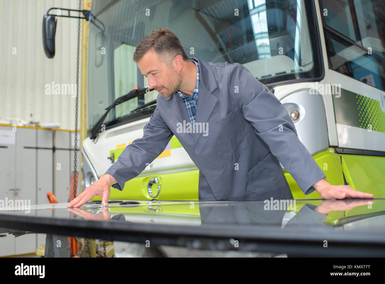 Mechanic working on a bus Stock Photo - Alamy