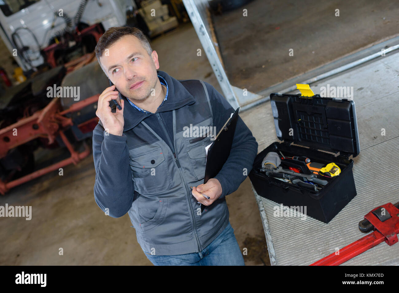 Auto mechanic talking car owner hi-res stock photography and images - Alamy