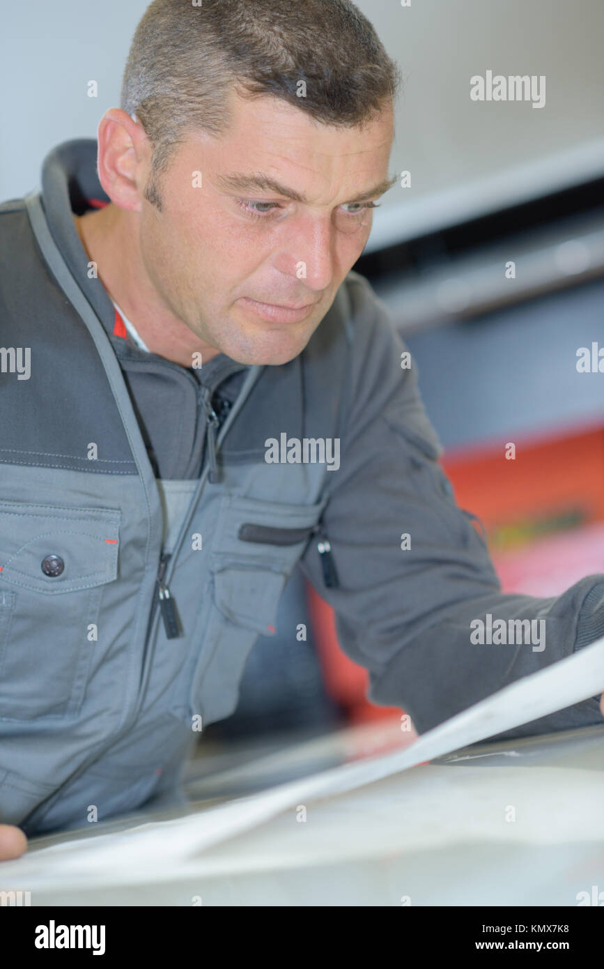man working in a factory Stock Photo - Alamy