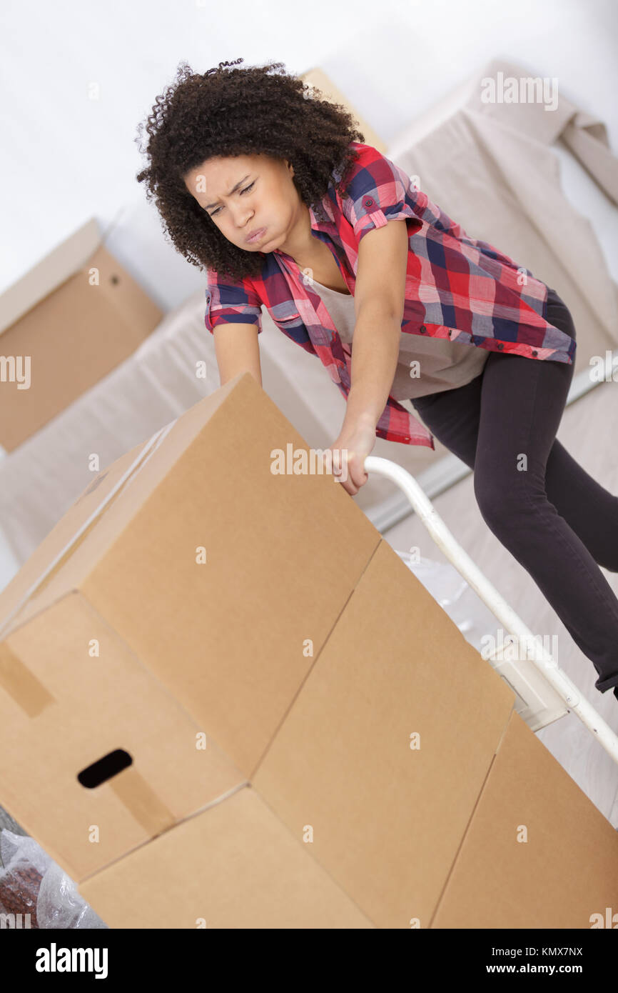 Unhappy woman packing boxes hi-res stock photography and images - Alamy