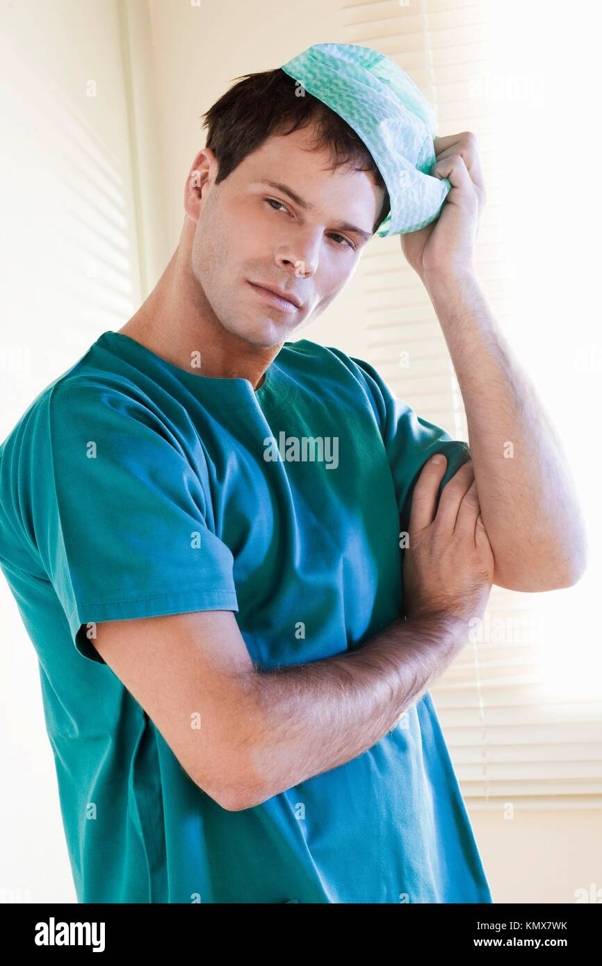 Portrait of a tired male surgeon Stock Photo - Alamy
