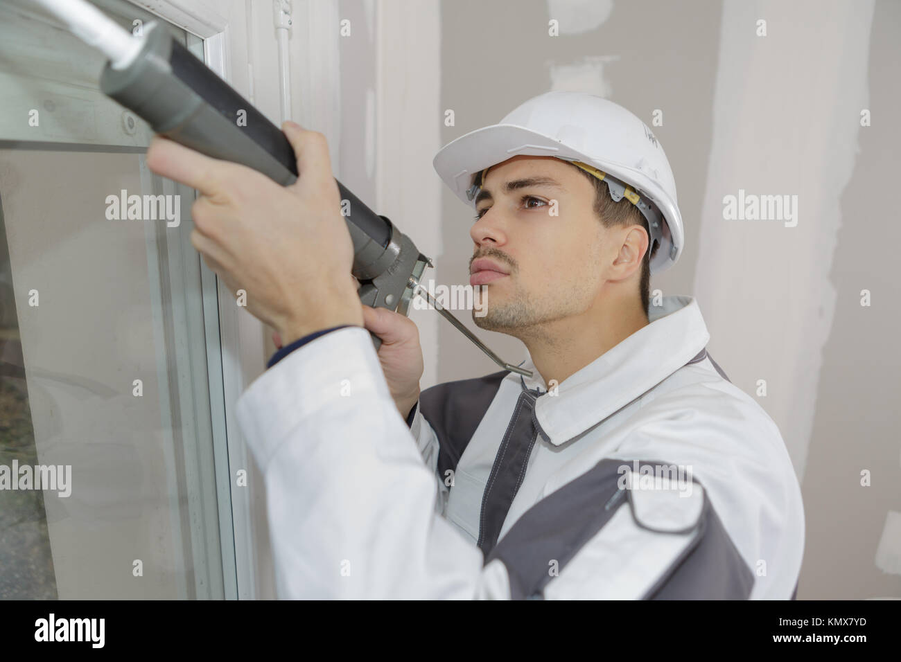 glazier installing the new window Stock Photo - Alamy