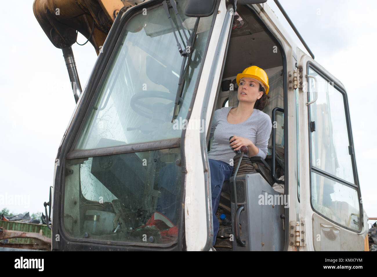Woman operating grab machine Stock Photo - Alamy
