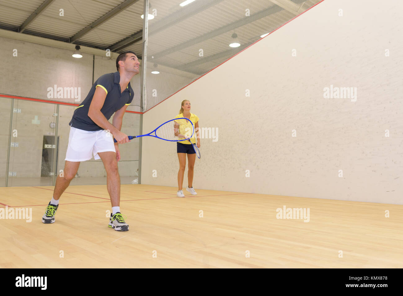 man playing squash Stock Photo - Alamy