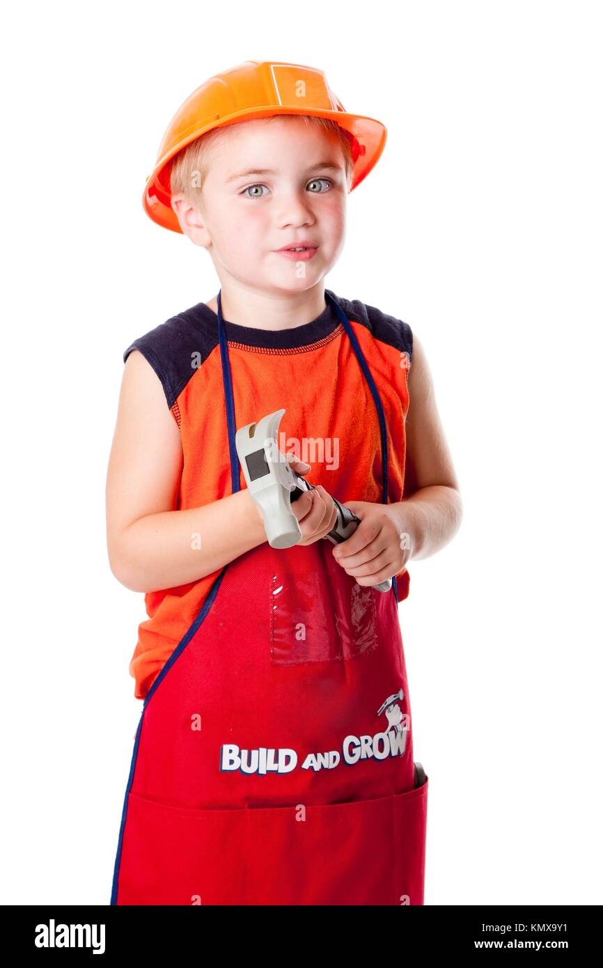 Little Caucasian boy dressed in orrange with construction helmet and ...