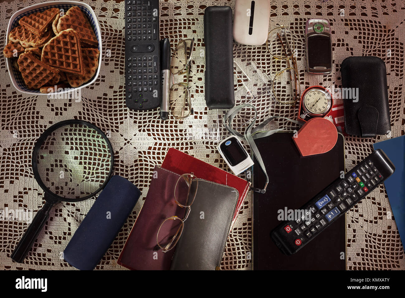 Closeup view of various living room objects, remote controllers, some ...