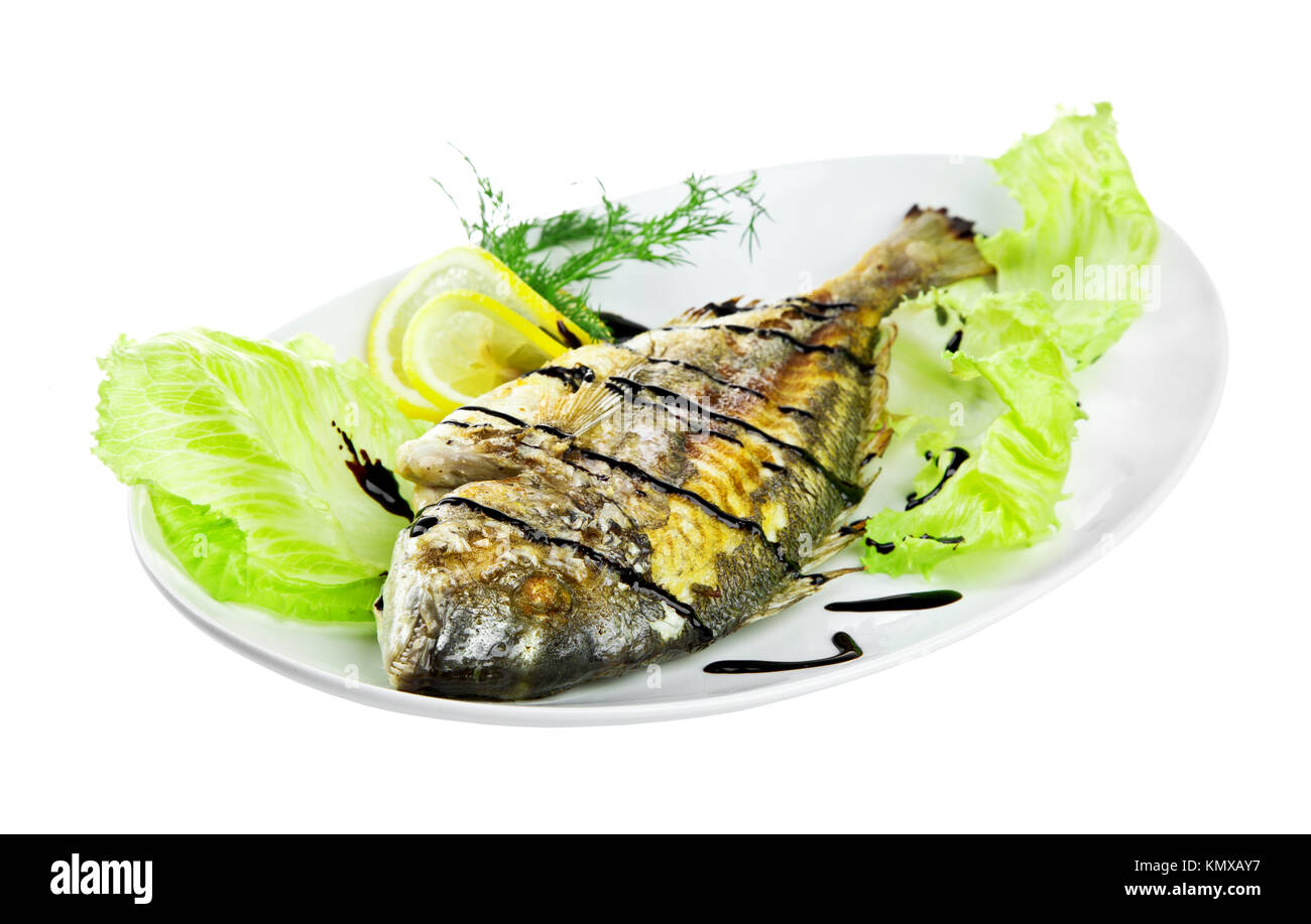 roast fish isolated on a white background Stock Photo - Alamy
