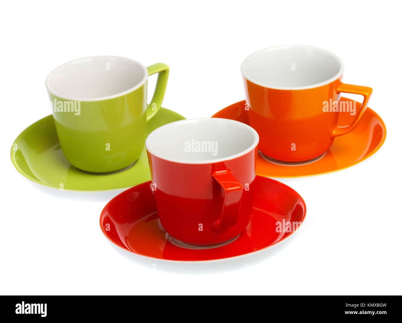 Three multi-coloured cups on a white background Stock Photo - Alamy