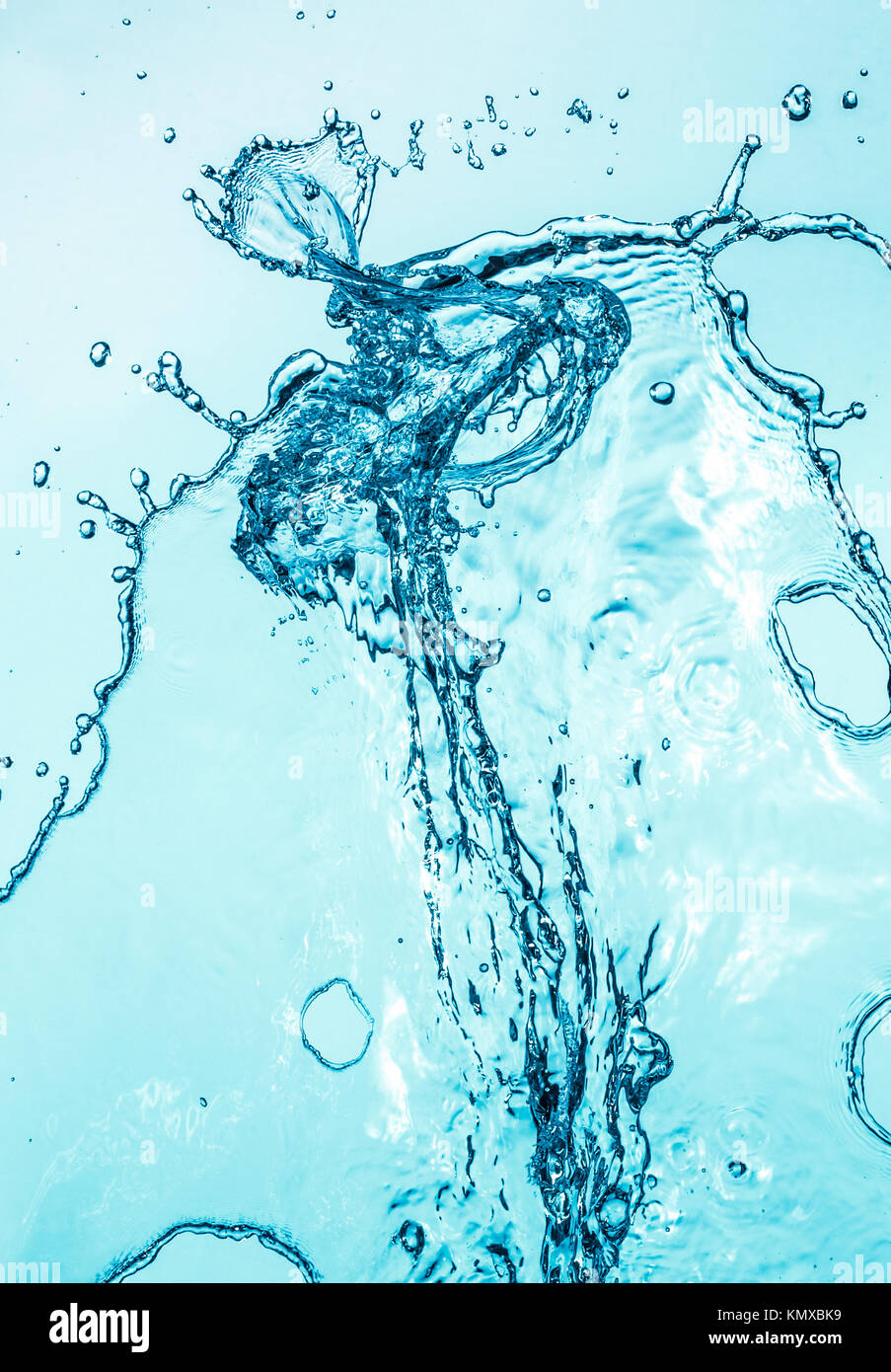 Abstract water splash on blue background Stock Photo - Alamy