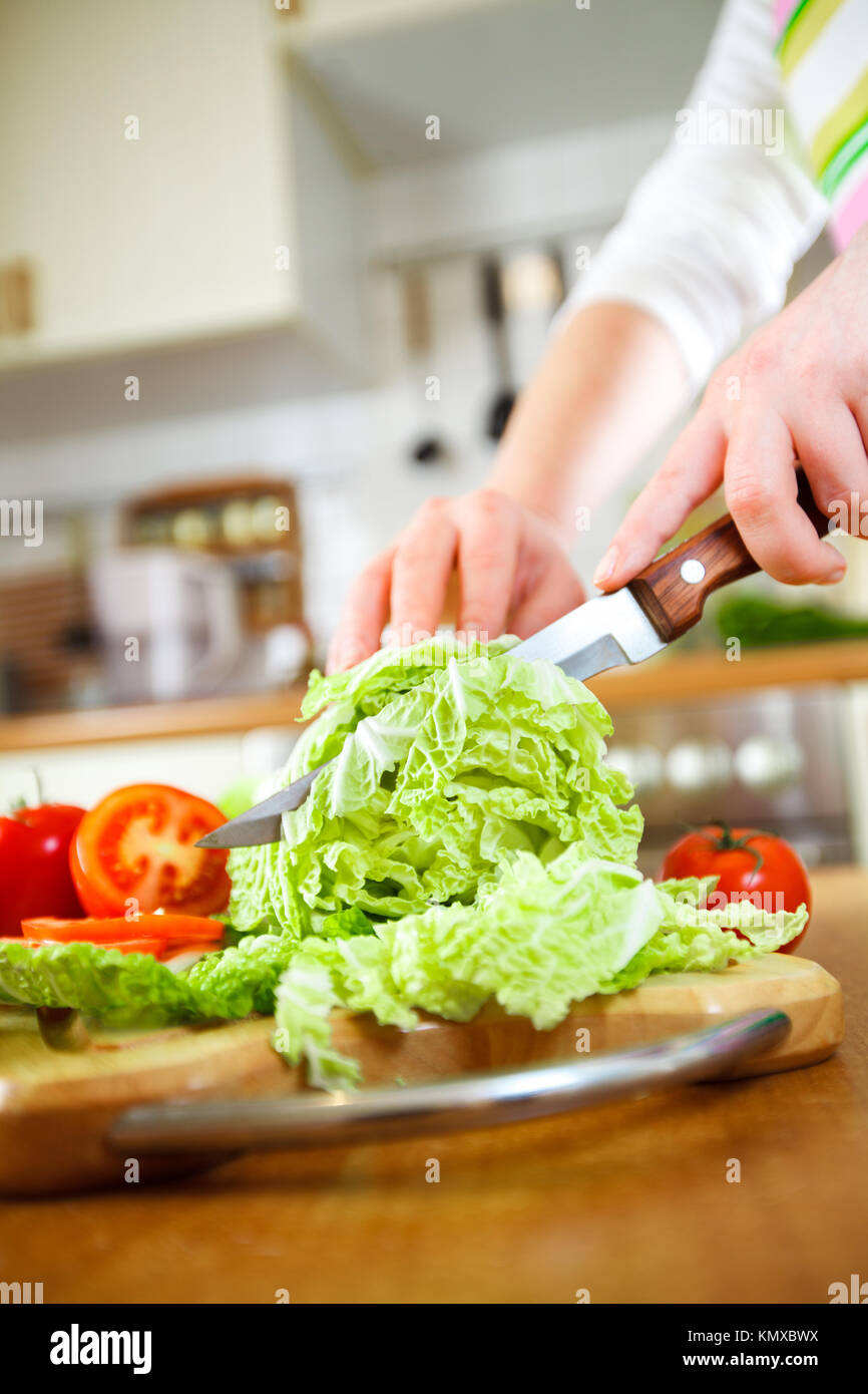Womans hands cutting lettuce hi-res stock photography and images - Alamy