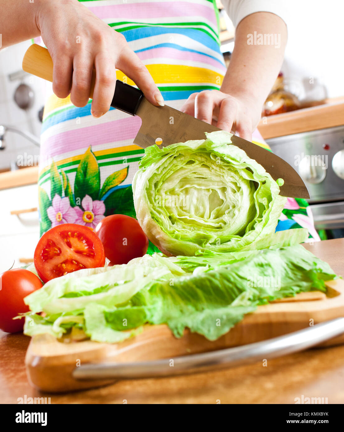 Womans hands cutting lettuce hi-res stock photography and images - Alamy