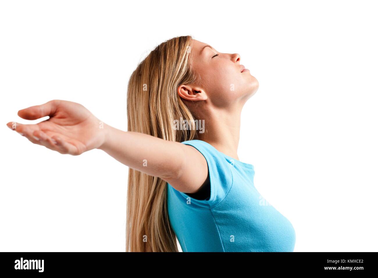 Relaxed young woman with arms outstretched, isolated on white Stock ...