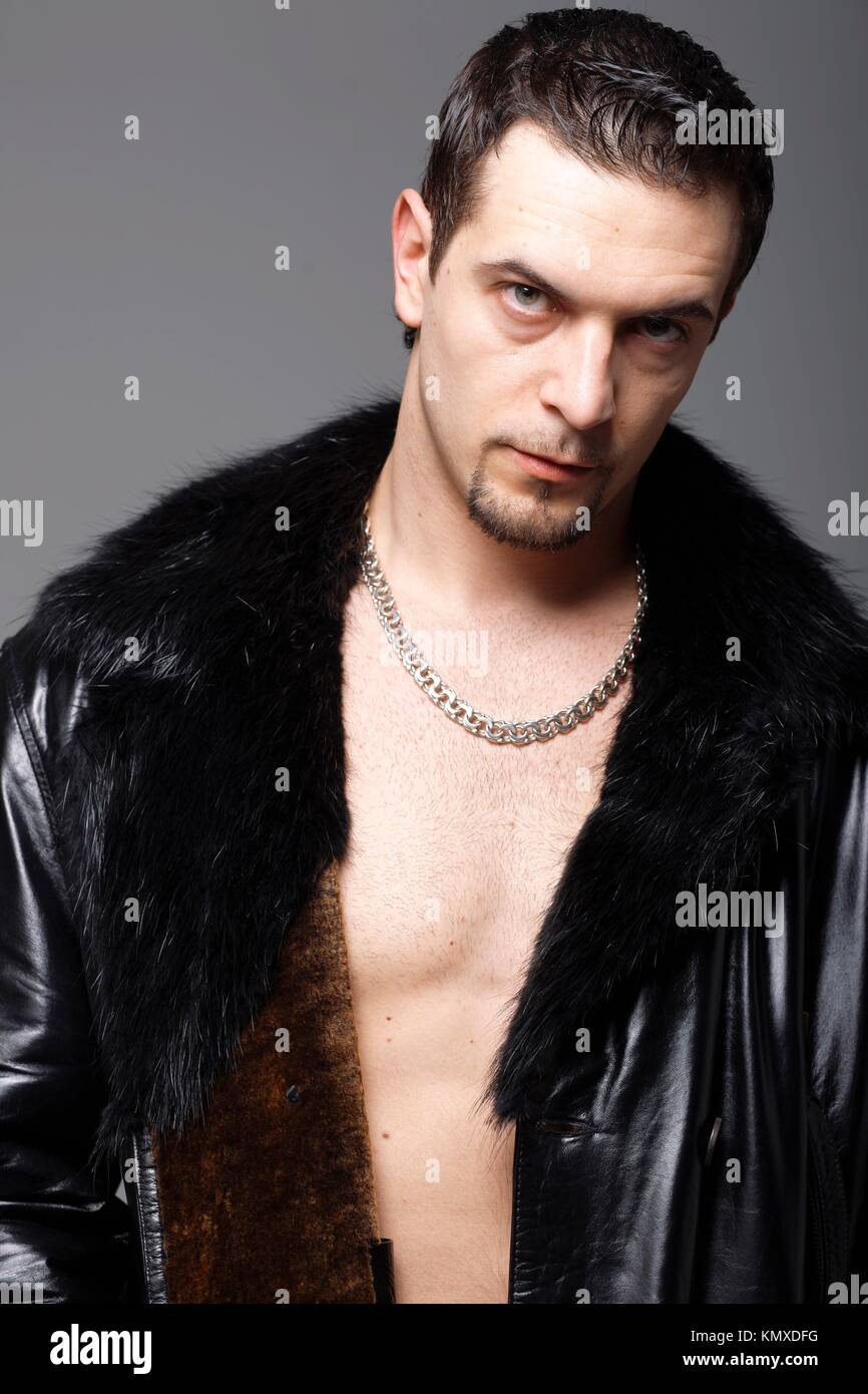 Muscular man in leather jacket hi-res stock photography and images - Alamy